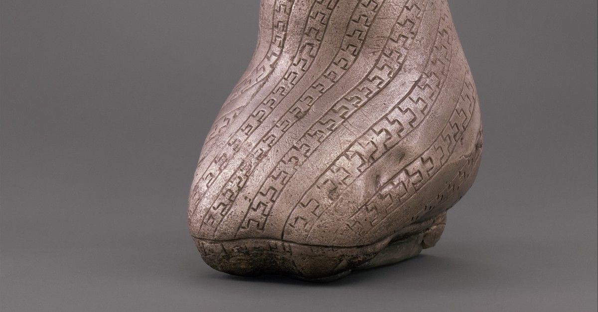 Kneeling Bull Holding Vessel - World History Encyclopedia