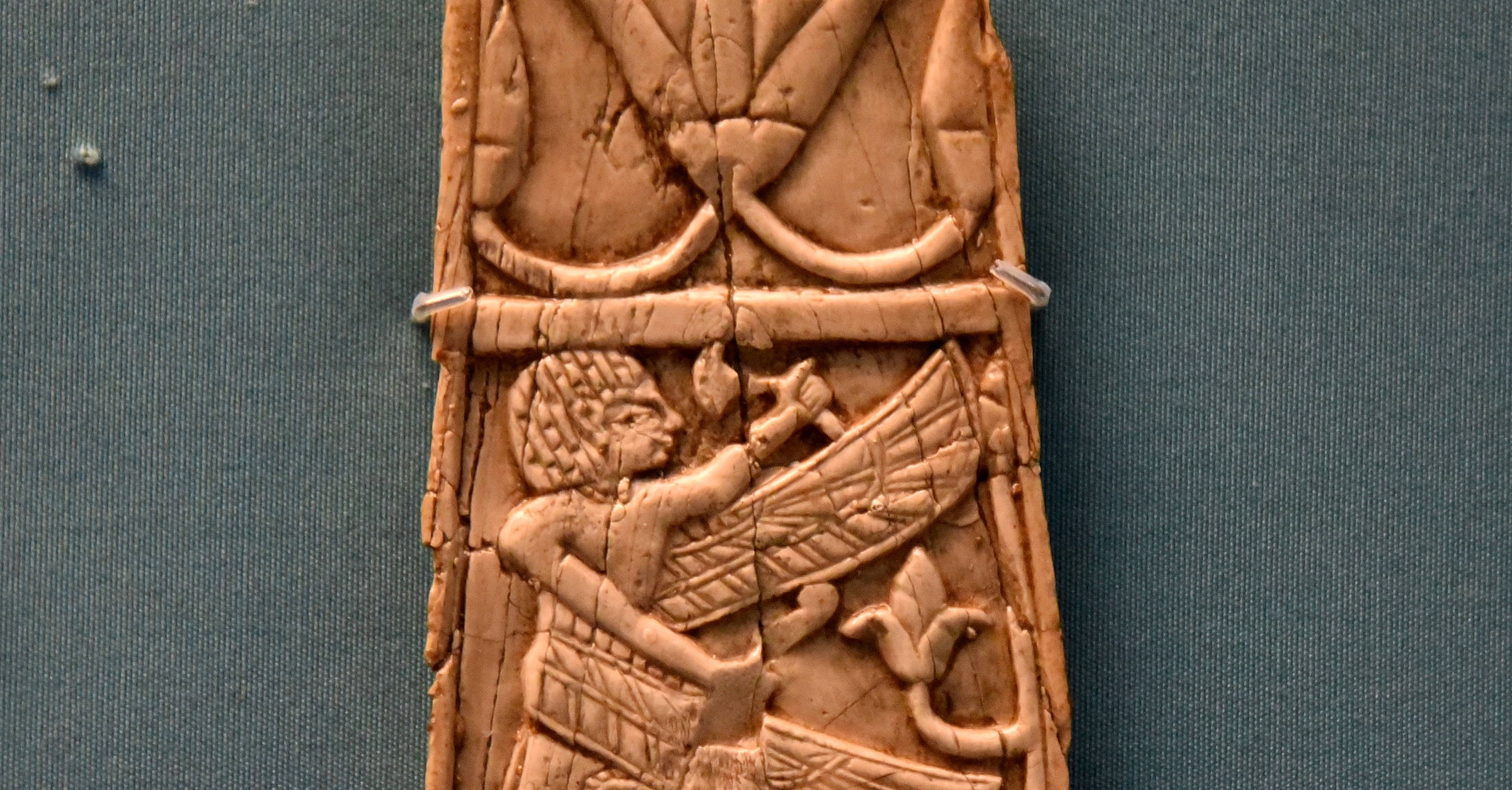 Nimrud Ivory Panel of a Winged Man - World History Encyclopedia